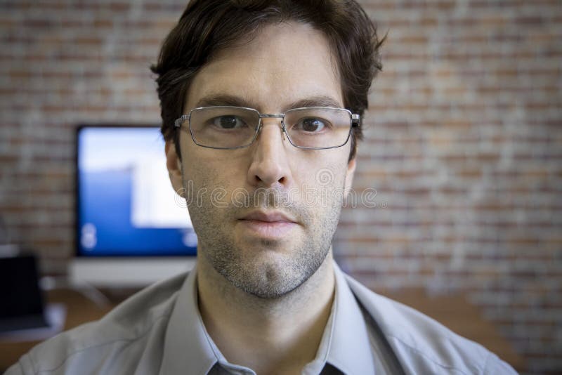 Man Looking Directly at the Camera Making a Conference Call Stock Photo ...