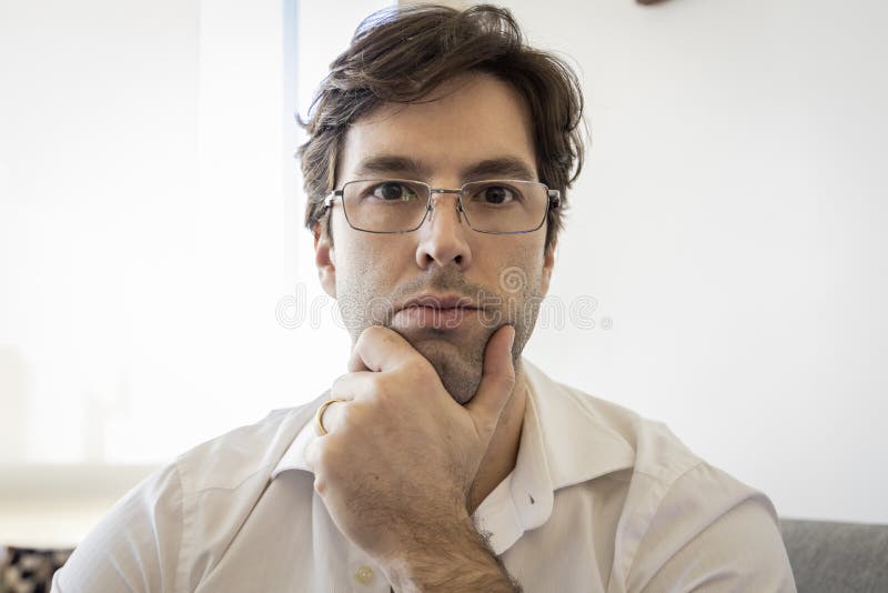 Man Looking Directly at the Camera Making a Conference Call Stock Photo ...