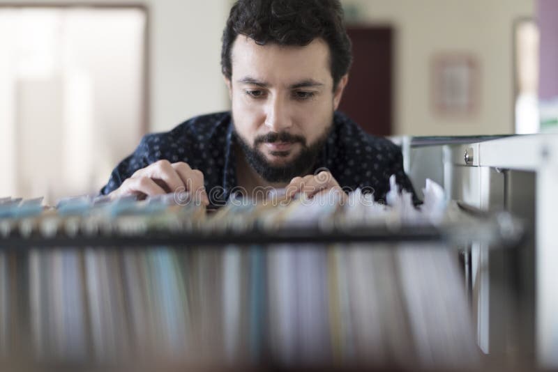 Man Looking in a Documentation File Drawer Stock Photo - Image of adult ...