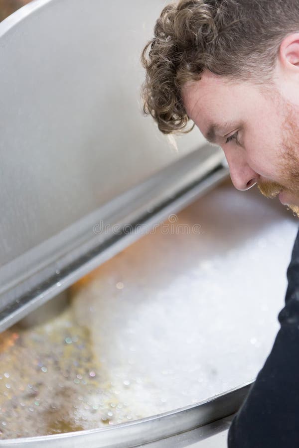 Man Looking Down on Beer Froth Stock Photo - Image of vertical, startup ...