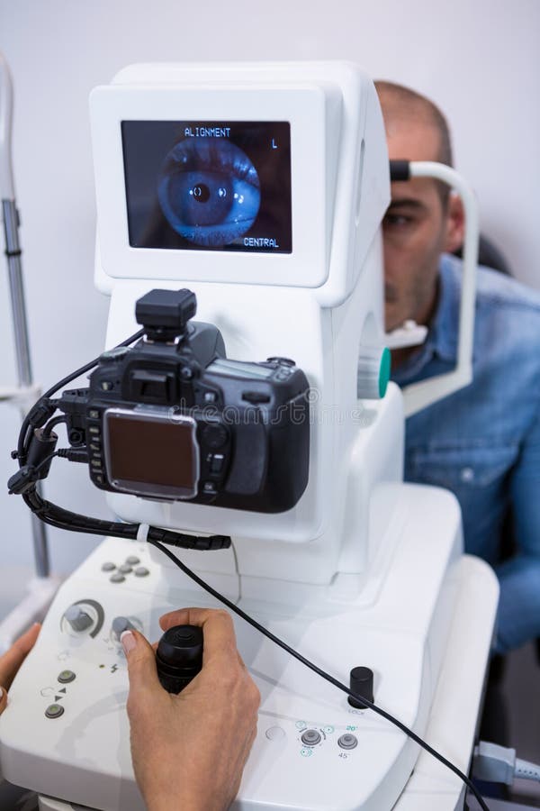 Man Looking at Eye Test Machine Stock Image - Image of eyesight, mature ...