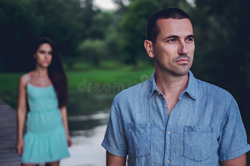 Man Looking Far Away and Girl Looking at Him Stock Photo - Image of ...