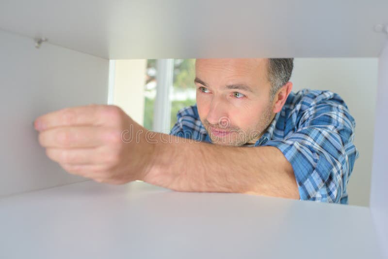 Man Looking Fixing Something Inside Box Stock Image - Image of ...