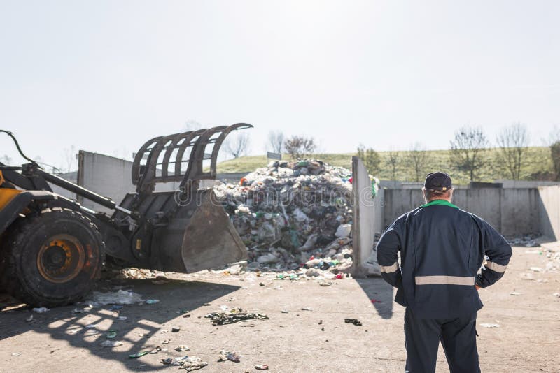 Man Looking at Garbage at Landfill Stock Photo - Image of male, people ...
