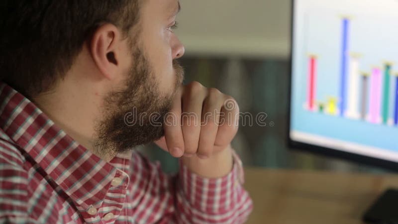 Man Looking at Graphs on the Computer Monitor Stock Footage - Video of ...