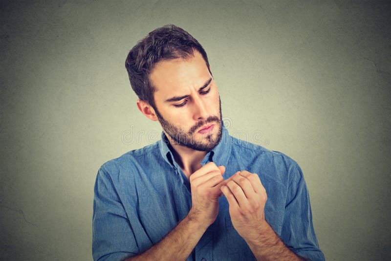 Man Looking at Hands Nails Obsessing about Cleanliness Germs Stock ...