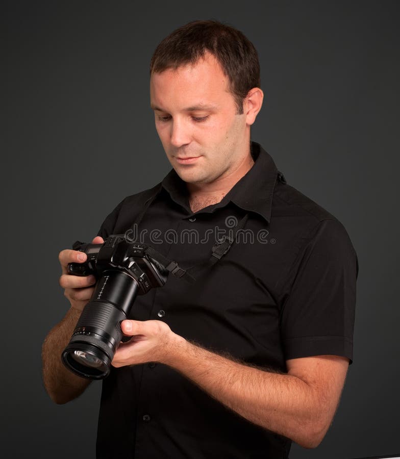 Man looking at his camera stock photo. Image of professional - 22426306