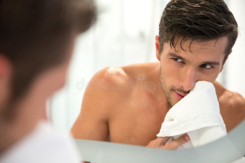 Man Looking at His Reflection in the Mirror Stock Image - Image of ...