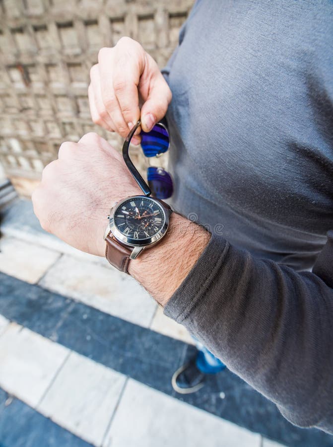 Man Looking at His Watch - Pointing with Sunglasses Stock Photo - Image ...