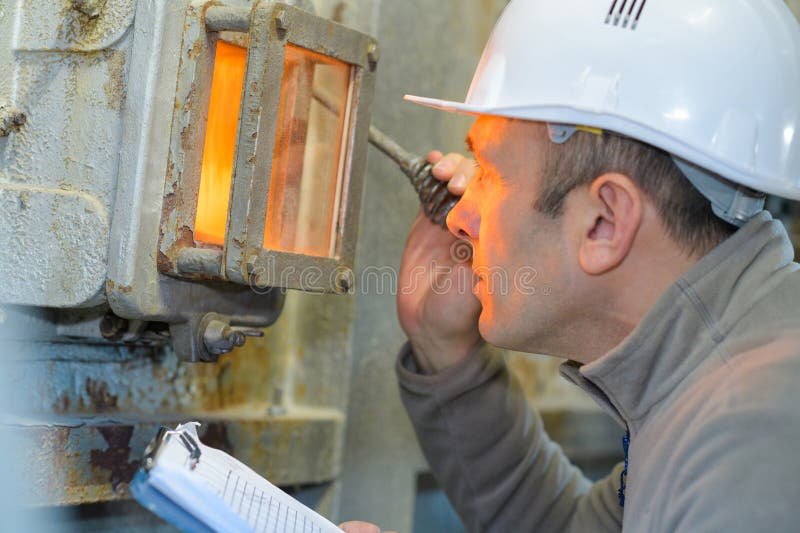 Man Looking through Inspection Glass Industrial Incinerator Stock Image ...