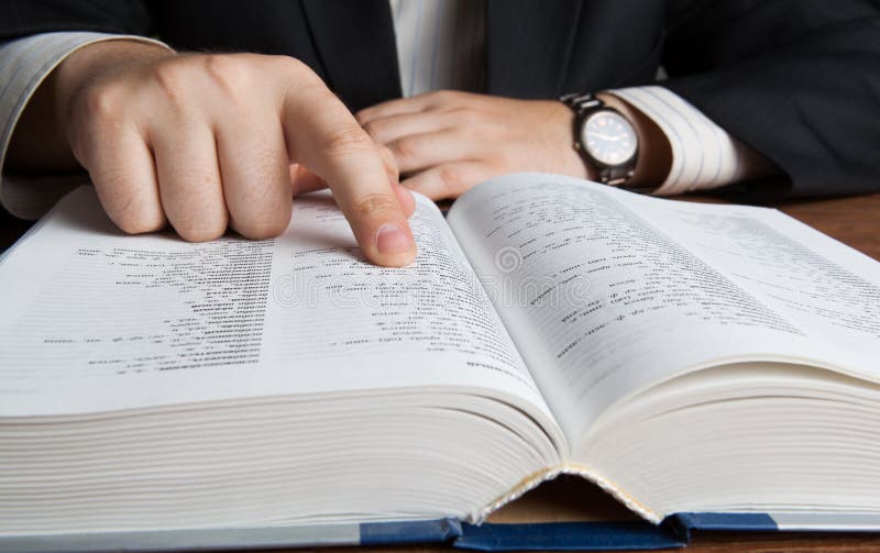 Man Looking in the Large Dictionary Stock Image - Image of close ...