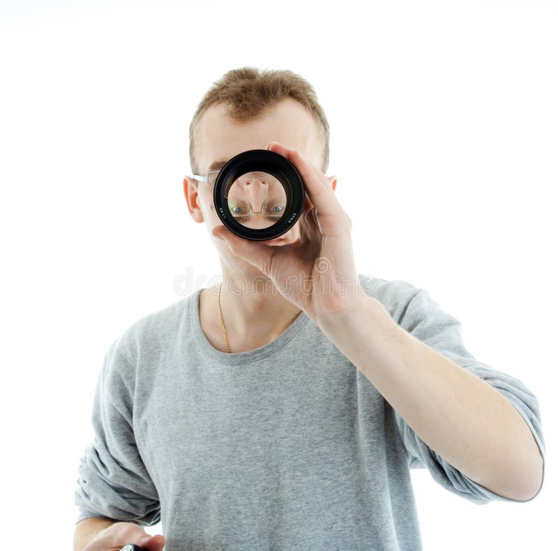 Man looking through a lens stock image. Image of lens - 85356793