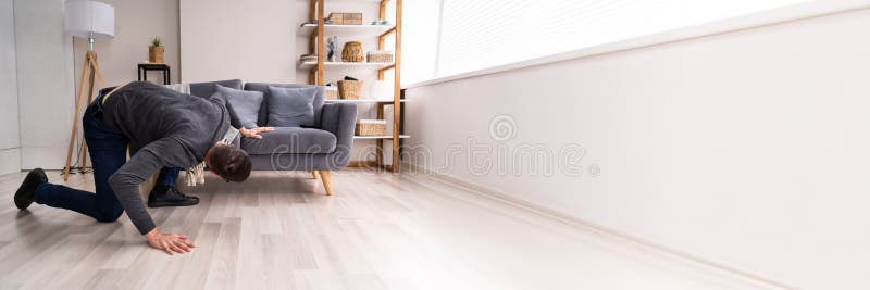 Man Looking for Lost Keys stock image. Image of hiding - 235591099