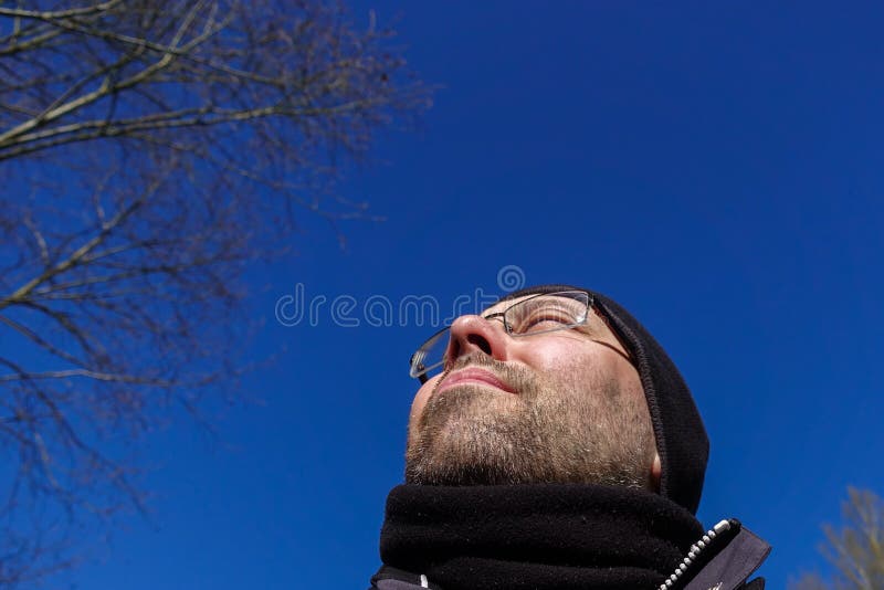 Man looking, low angle stock photo. Image of sunny, blue - 143619046