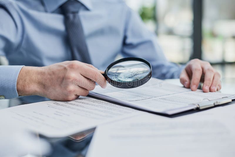 Businessman Looking through a Magnifying Glass To Documents Stock Image ...