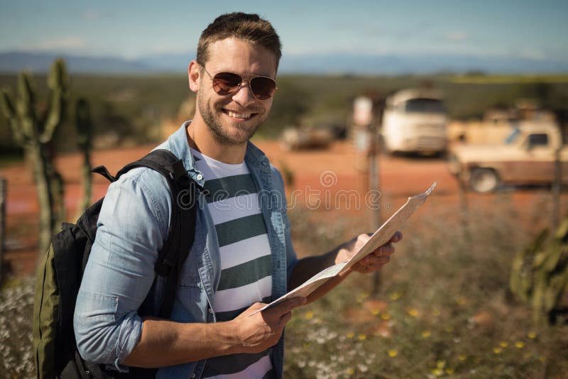 Man Looking at Map on a Sunny Day Stock Image - Image of adult ...