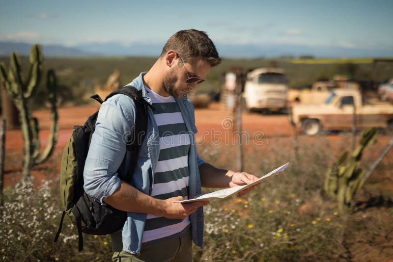 Man Looking at Map on a Sunny Day Stock Image - Image of sunglasses ...