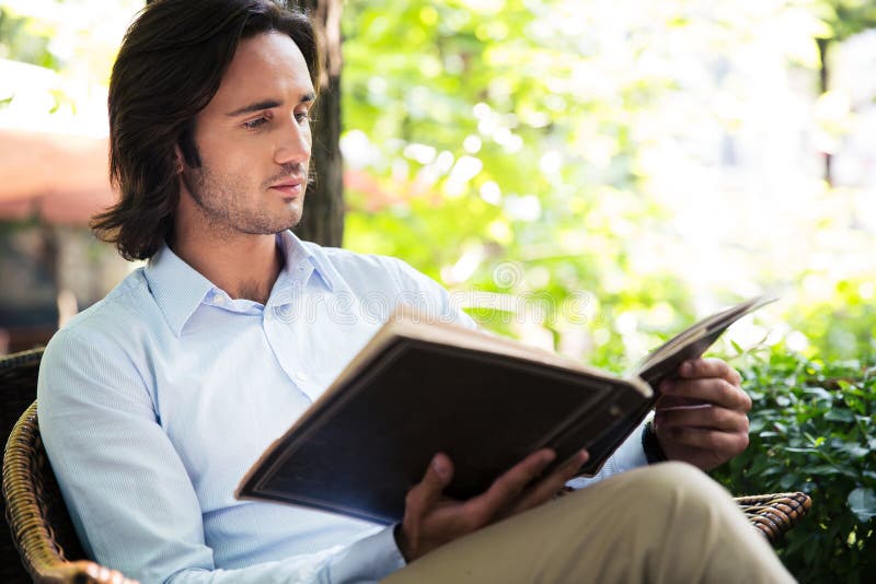 Man Looking at Menu in Cafe Stock Photo - Image of young, caucasian ...