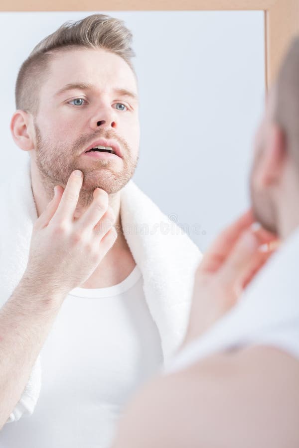 Man looking in the mirror stock photo. Image of person - 54279920