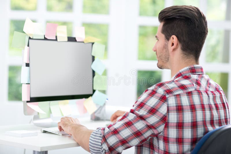 Man Looking at a Monitor with Sticky Note on it Stock Photo - Image of ...