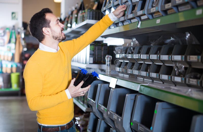 Man is Looking for the Necessary Garden Tools Stock Photo - Image of ...