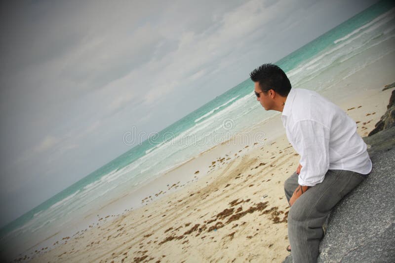 Man Looking at the Ocean stock image. Image of sitting - 4677283