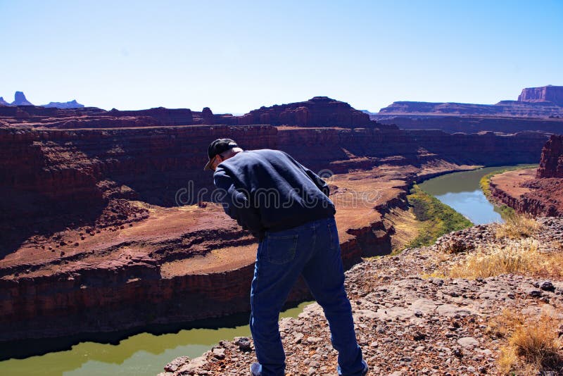 Man Looking Over The Edge stock image. Image of holding - 3048749