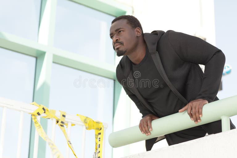 Man looking over the ledge stock photo. Image of attractive - 22304892