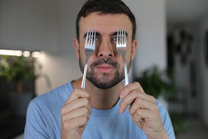Man Looking through Pair of Forks Stock Image - Image of detention ...