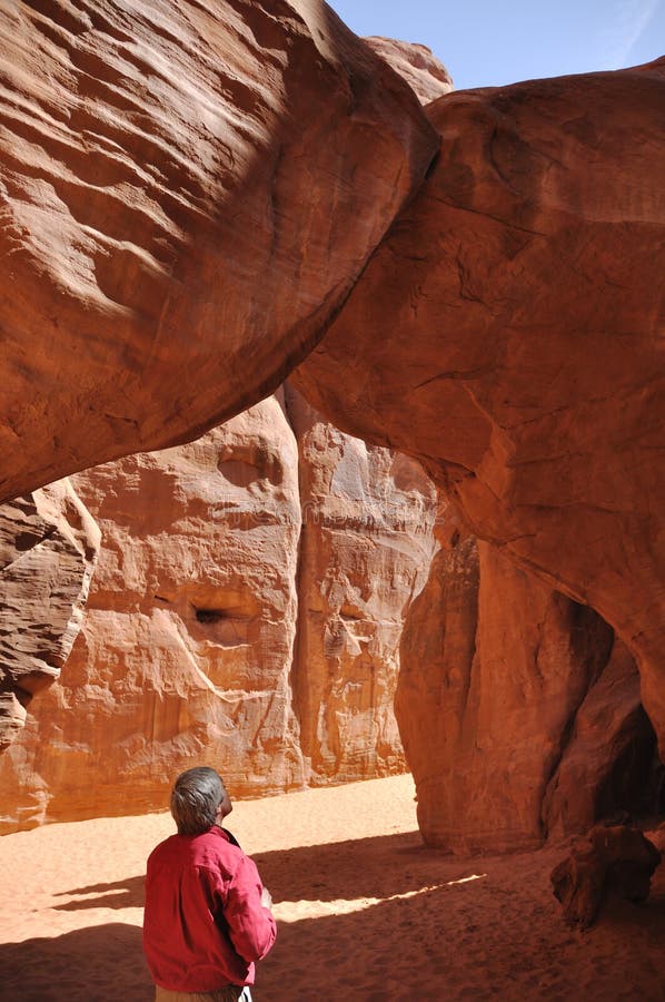 Man Looking at the Sand Dune Arch Stock Image - Image of lone, alone ...