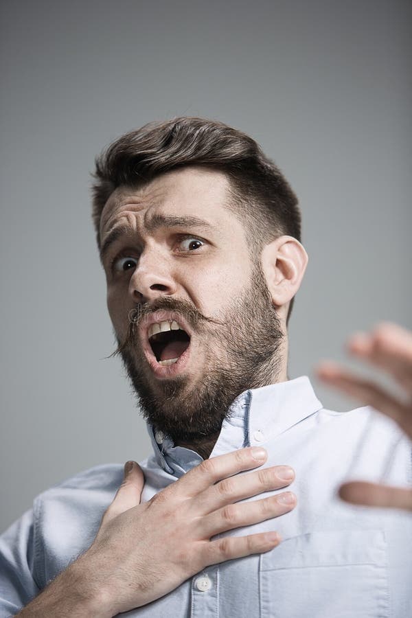 Man is Looking Scared. Over Gray Background Stock Image - Image of ...