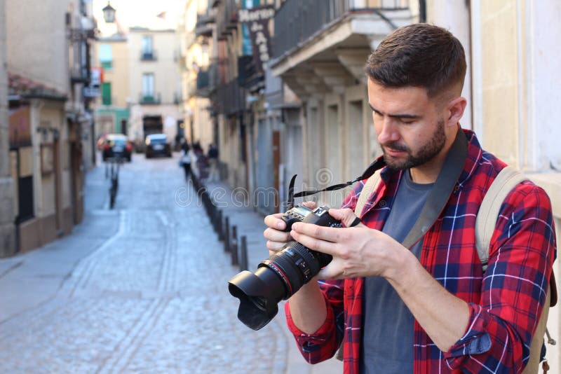 Man Looking at the Screen of His Professional Camera during a Trip ...
