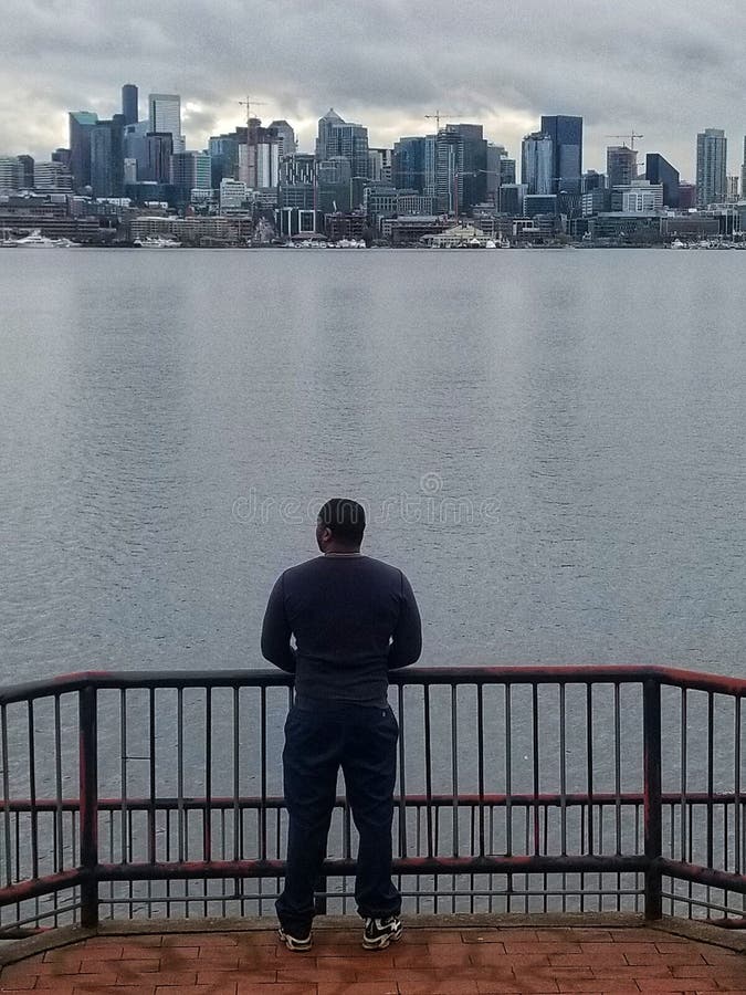 Man Looking at Seattle Skyline from Gas Works Park in Seattle, Ohio ...
