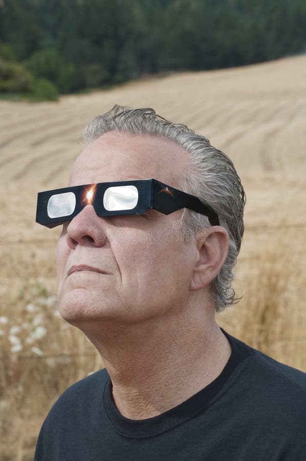 Man Looking at the Solar Eclipse with Eclipse Glasses Stock Image ...