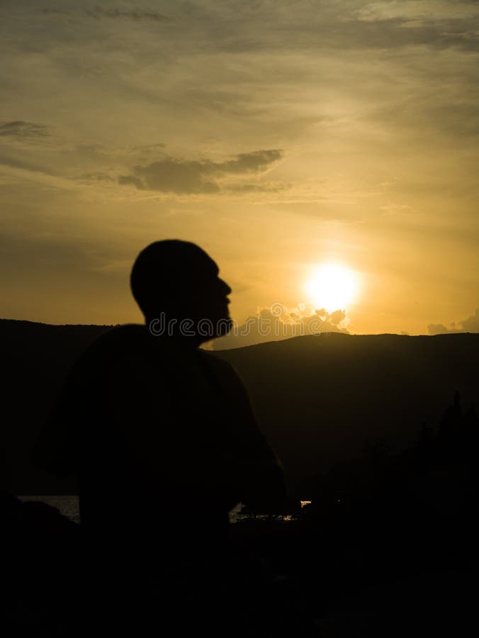 Man looking at the sun stock photo. Image of light, energy - 89031828