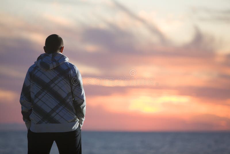 Man looking at sunset stock image. Image of coast, travel - 14618619