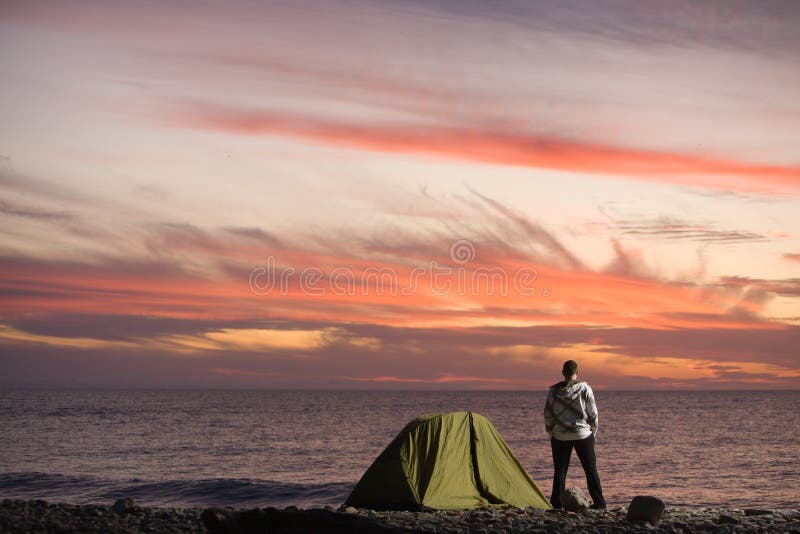 Man looking at sunset stock photo. Image of equipment - 25183730