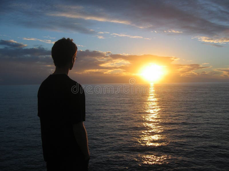 Man looking at sunset stock photo. Image of shore, late - 423432