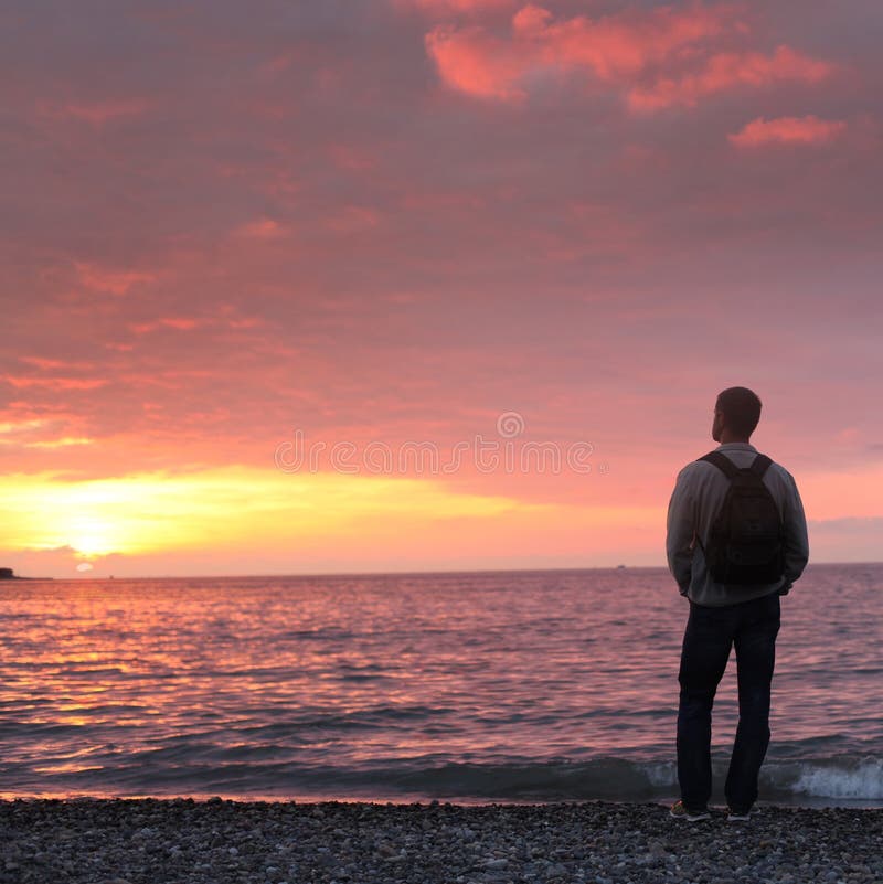 Man Looking At The Sunset On A Beach Stock Photo - Image of dawn ...