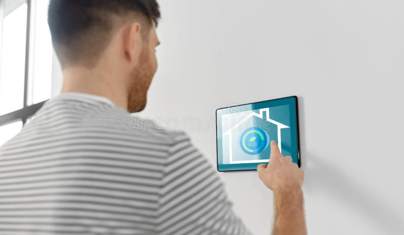 Man Looking at Tablet Computer at Smart Home Stock Image - Image of ...