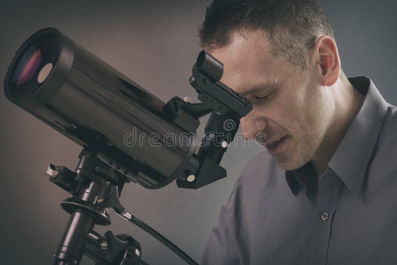 Man Looking through Telescope Stock Photo - Image of face, search ...