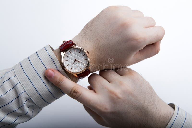 Man looking at the time stock image. Image of finger - 67544341