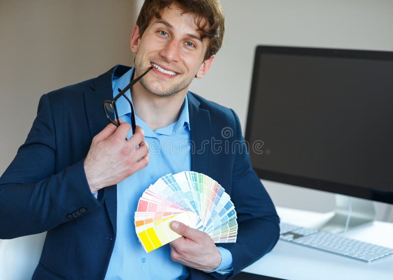 Man Looking To a Color Paint Palette at Home Office Stock Photo - Image ...