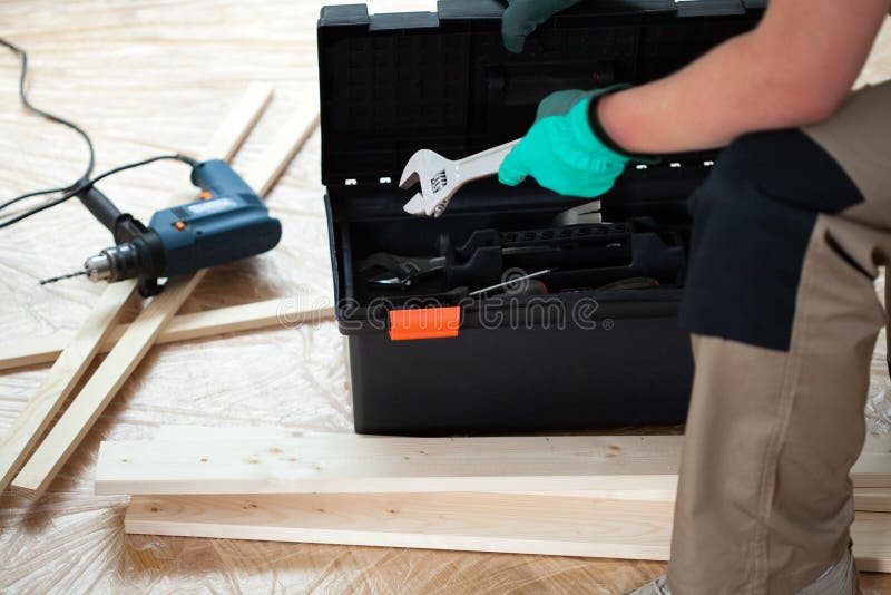 Man looking for a tools stock photo. Image of manual - 43415928