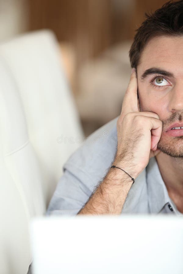 A Man Looking Up Behind a Laptop Stock Image - Image of problem ...