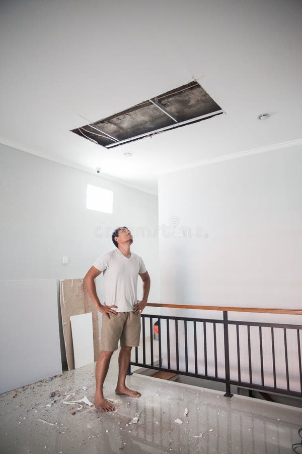 Man Looking Up the Broken Ceiling Stock Image - Image of adult ...