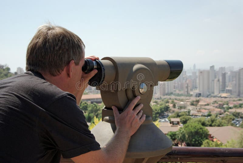 Man Looking through View Telescope. Vertical Stock Stock Photo - Image ...