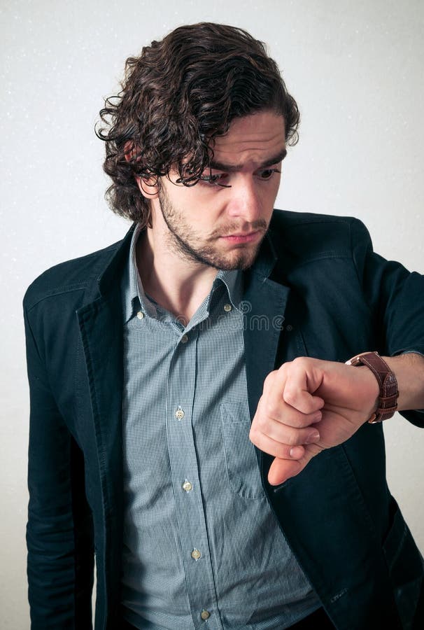 Man looking on watch stock photo. Image of phone, male - 80000414