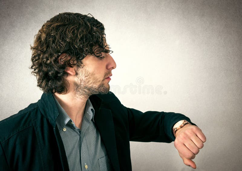 Man looking on watch stock photo. Image of clock, look - 80000456