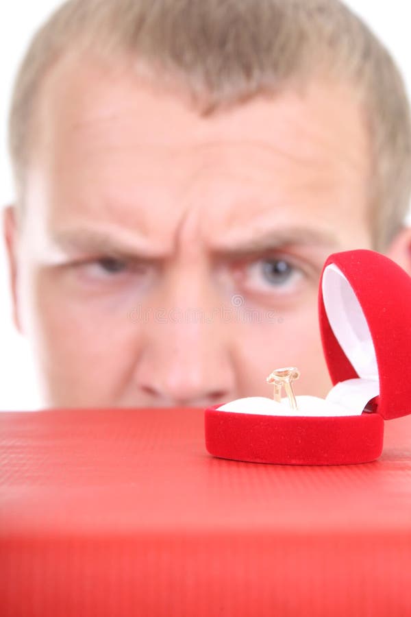 Man Looking at Wedding Ring. Focus on Ring Stock Photo - Image of ...